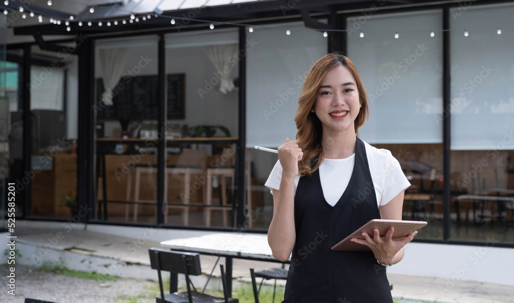 Attractive beautiful young Asian female restaurant or coffee shop ...