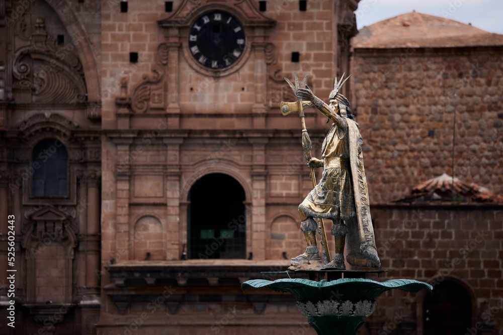 Monument to Atahualpa the ruler of Incas in front of old buildings ...