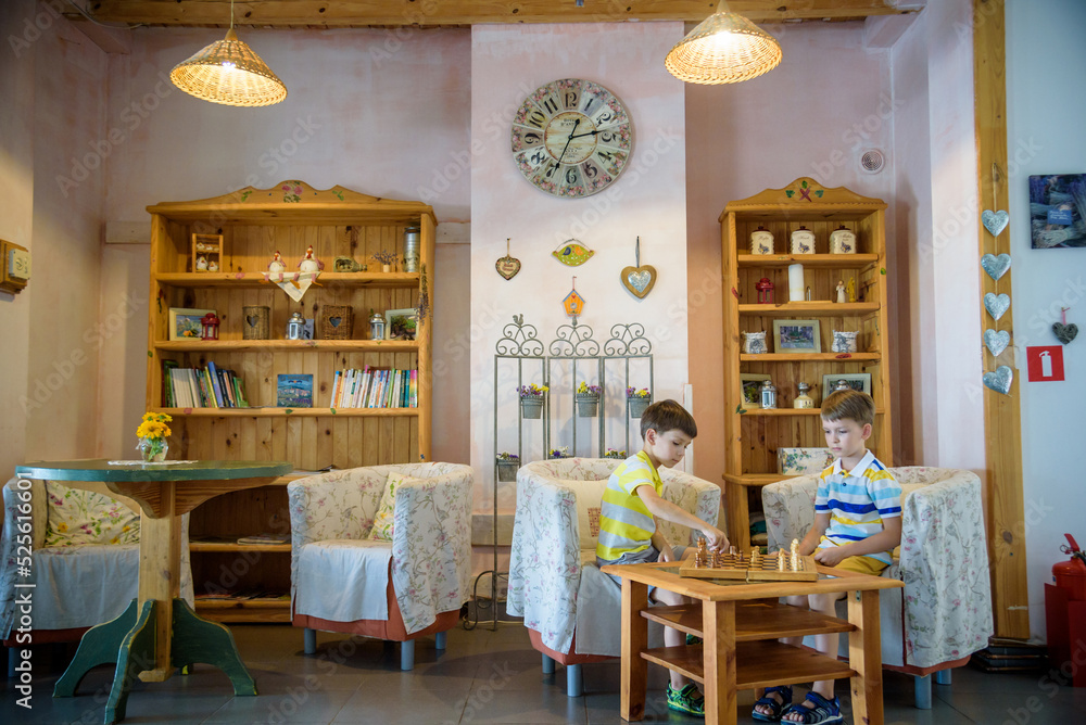 Vivid emotions during the game of chess. two young chess players inside ...