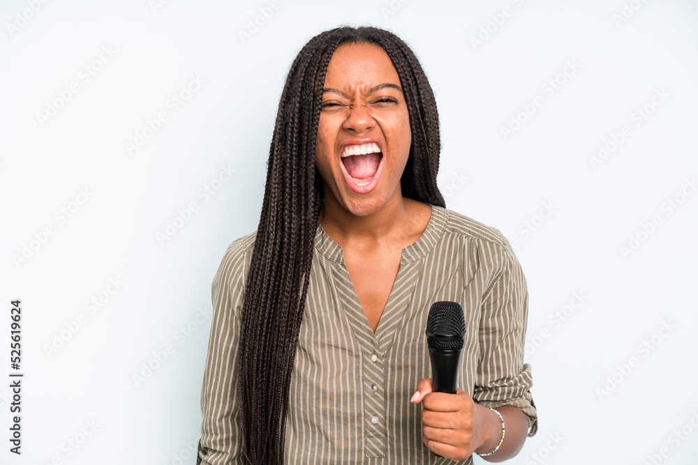 black pretty woman shouting aggressively, looking very angry. singer ...