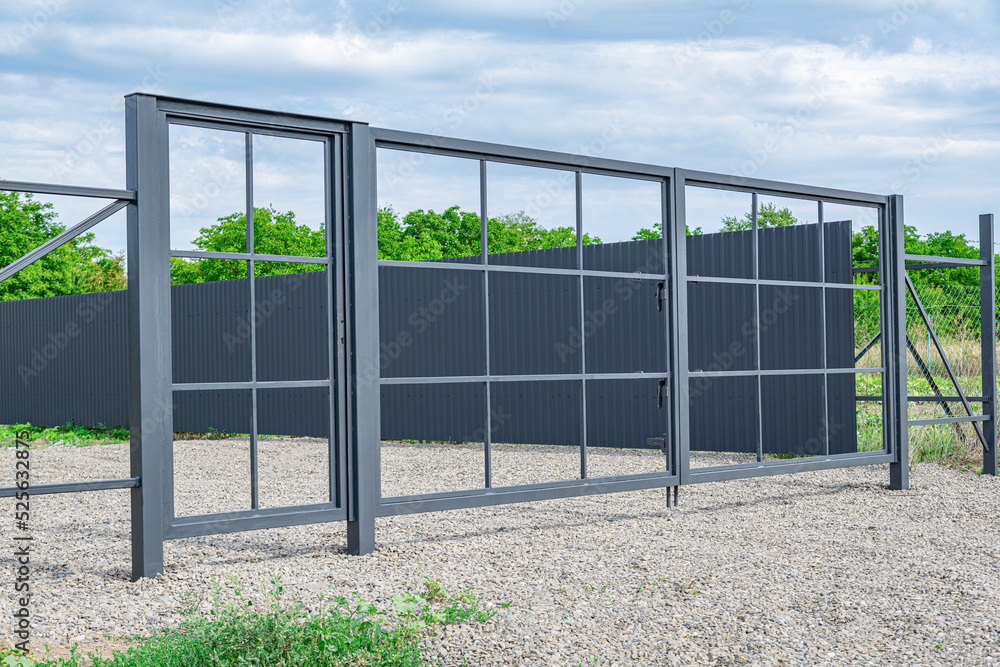 Installation of metal gates. Gate from a profile pipe in the process of ...