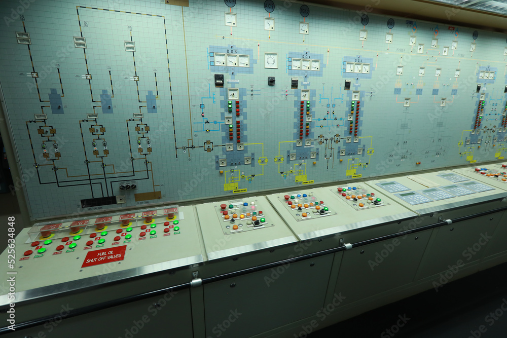 ship engine room dashboard with plenty of bottoms, indicators, small ...