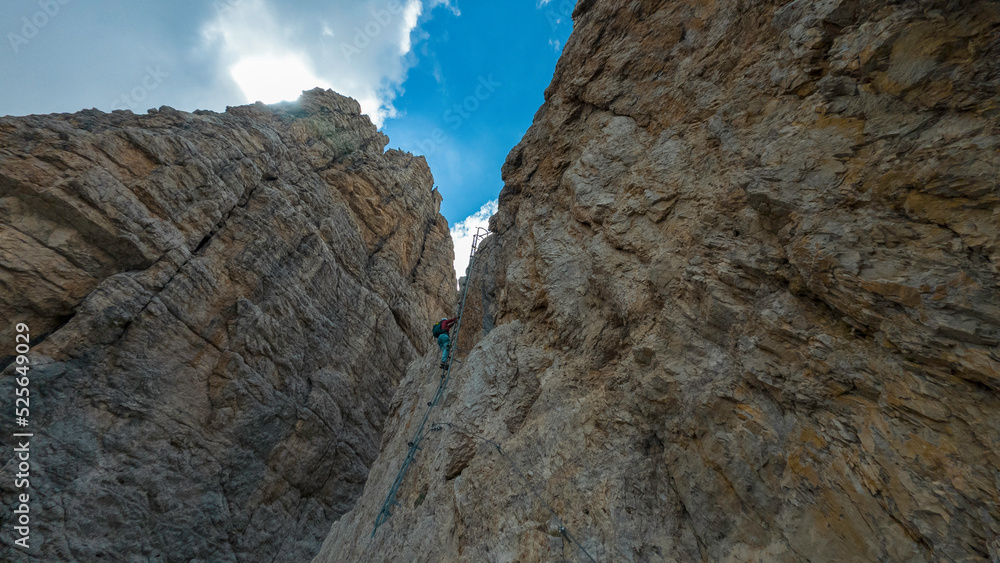 climbing the via ferrata "via delle bocchette" mountain sign in the ...