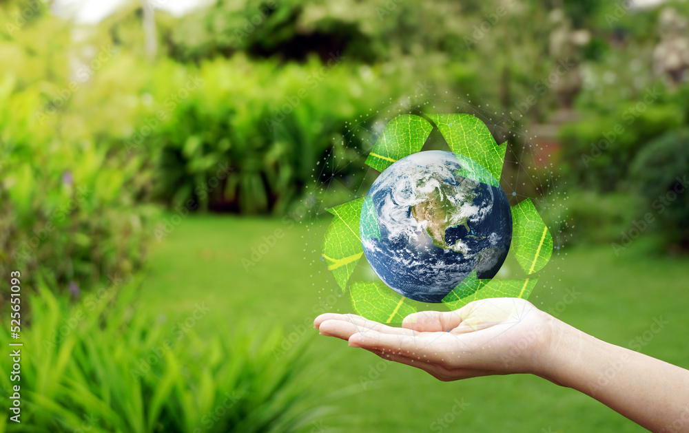 Save earth concept. Hands with Earth and recycle logo over green nature ...