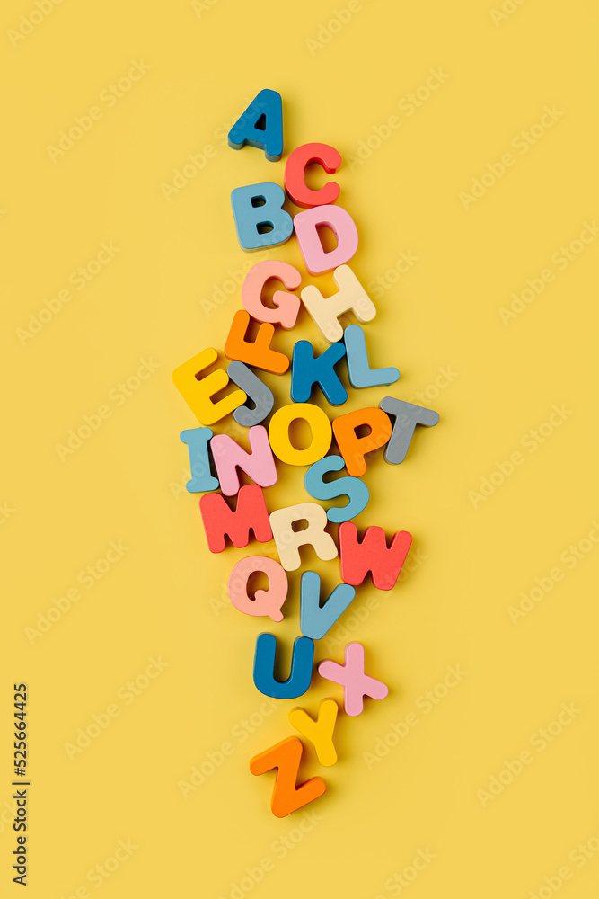Colorful letters of the alphabet on yellow background. Primary school ...