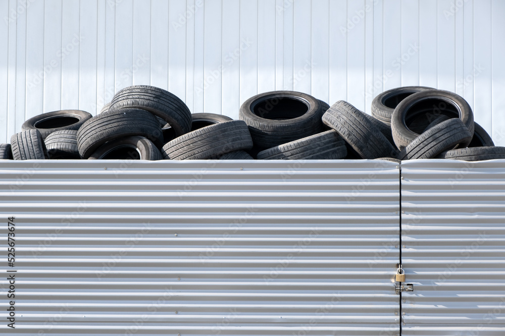 Waste rubber tires at landfill for recycling. Regenerated reuse of the ...