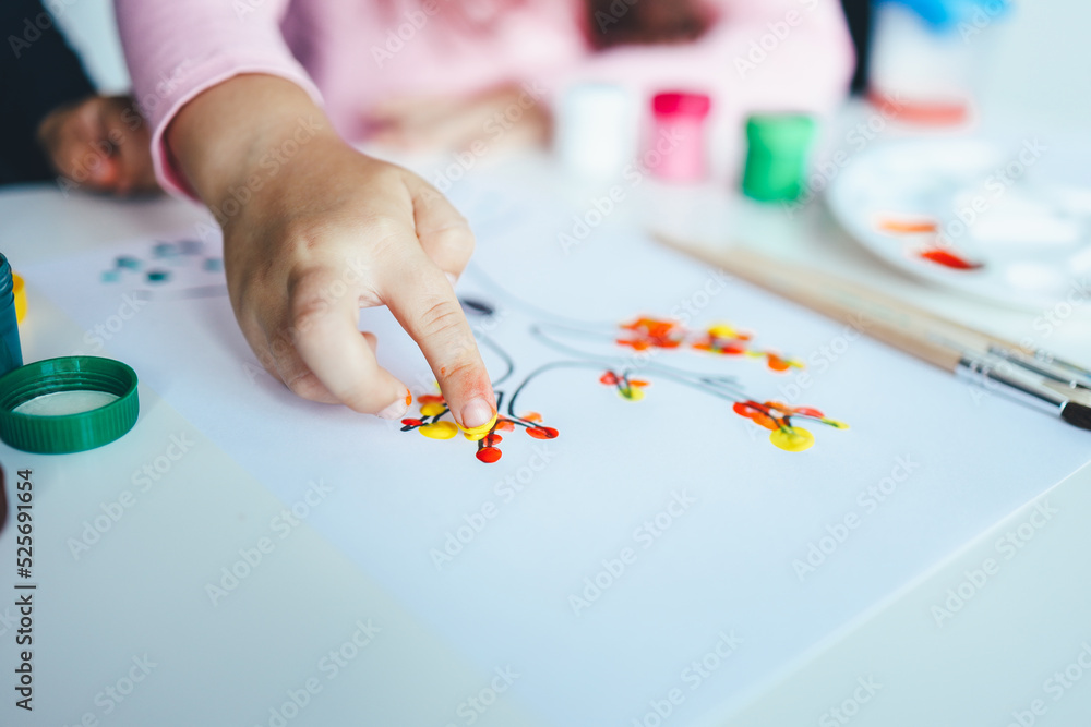 A child draws leafs on a tree. Ideas for drawing with finger paints ...