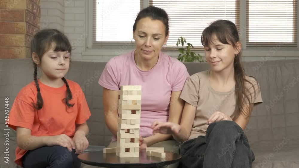 Team family game. A view of team family with wooden blocks on the table ...