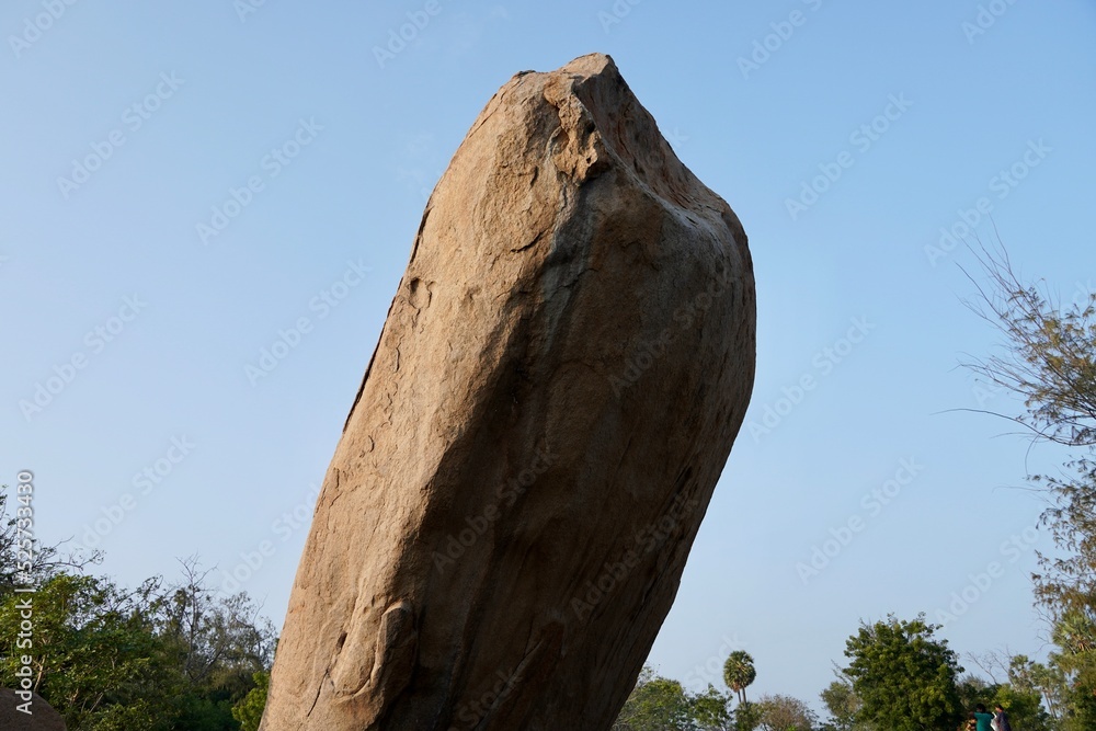 Giant granite rock against blue sky background in Mahabalipuram ...