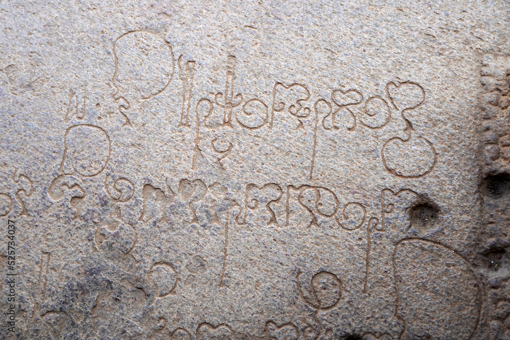Inscriptions on the ancient temple stone walls. Ancient stone carving ...