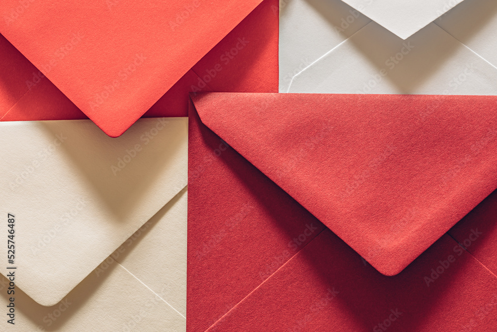 Different sizes and colors of textured paper open postal envelopes as a ...