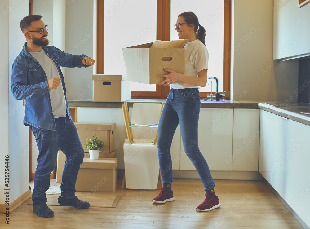 Couple holding boxes for moving the hands and have a dance with boxes ...