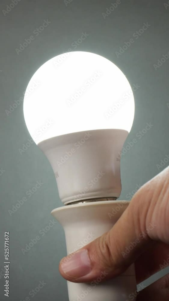 Shooting video, zoom out from the round LED lamp, use the hand grip. As ...