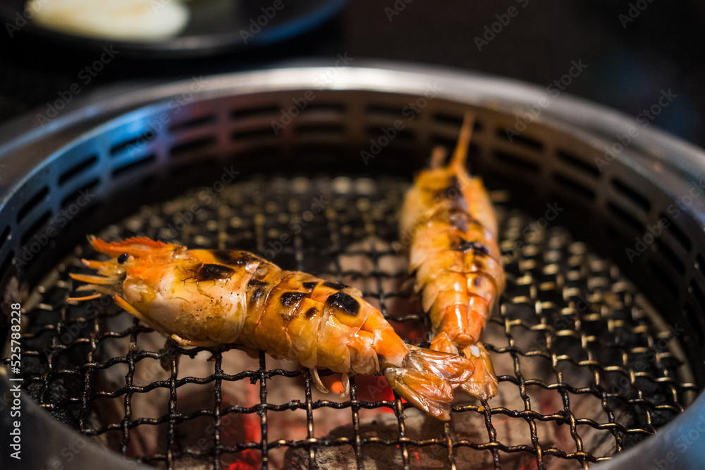 Grilled giant river prawn grilled over charcoal on a stove. Menu ...
