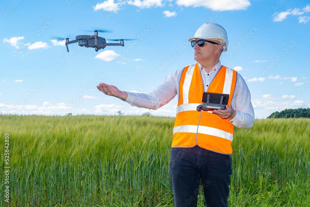 Professional surveyor. Man surveyor launches drone. Topographic survey ...