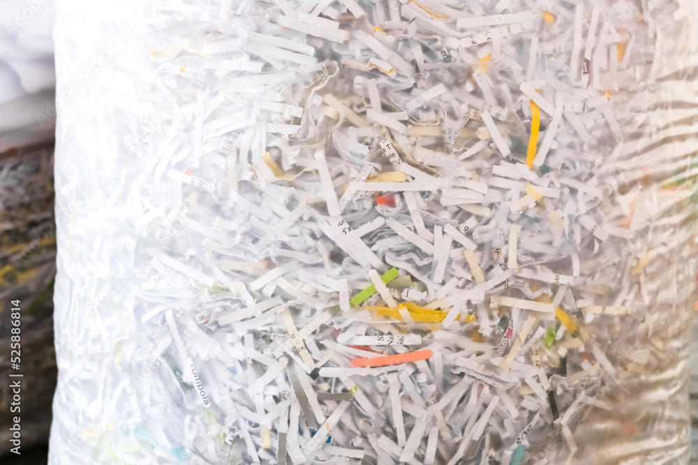 Shredded paper shreds in a bag, documents destroyed for privacy. Stock ...