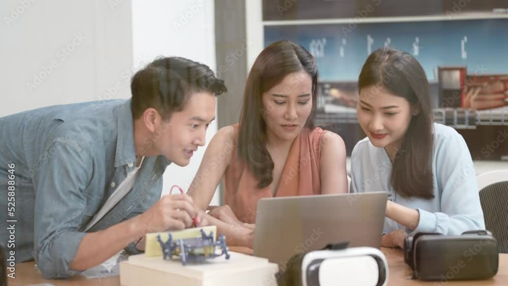team students of robotics preparing robot for testing in working space ...