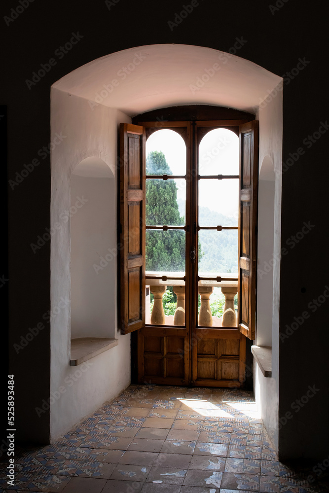 Vintage european interior, Arched corner with window, balcony entrance ...