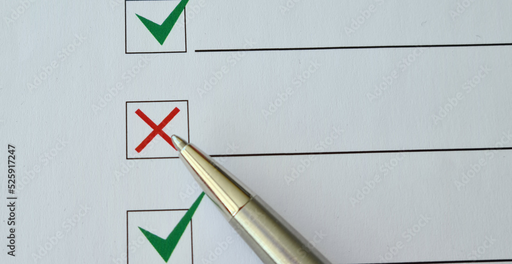 Check checklist of red and green marks with a pen Stock Photo | Adobe Stock