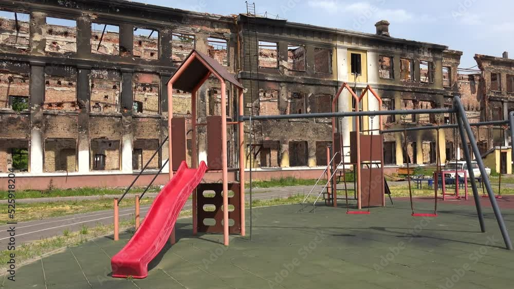 2022 - a badly damaged school building with children's playground ...