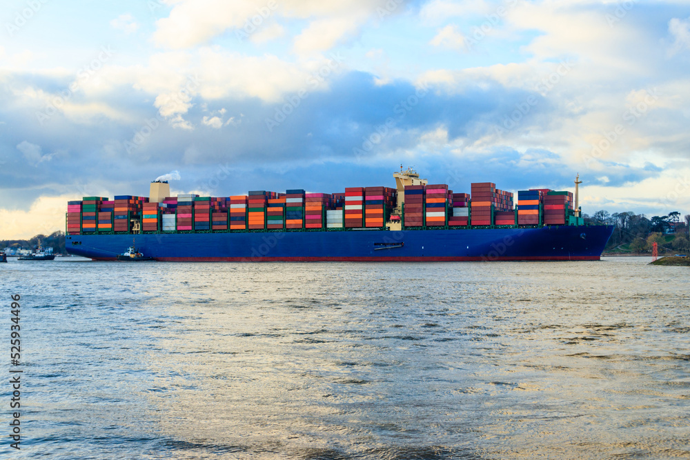 Huge cargo container ship sailing on the Elbe river, Hamburg, Germany ...