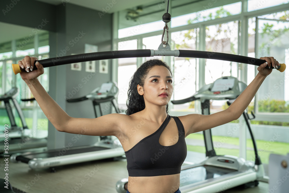 beautiful muscular fit woman exercising building muscles. Muscular ...