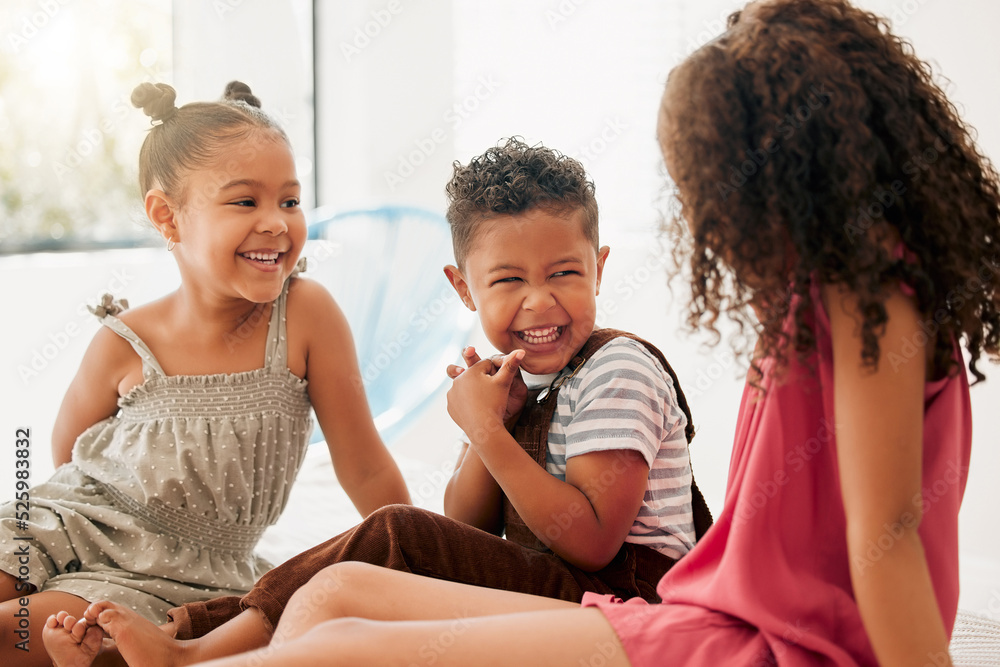 Happy, cheerful and laughing children sitting together and having fun ...