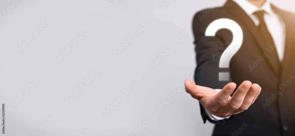 Male hand holding question mark icon on neon red,blue,purple background ...