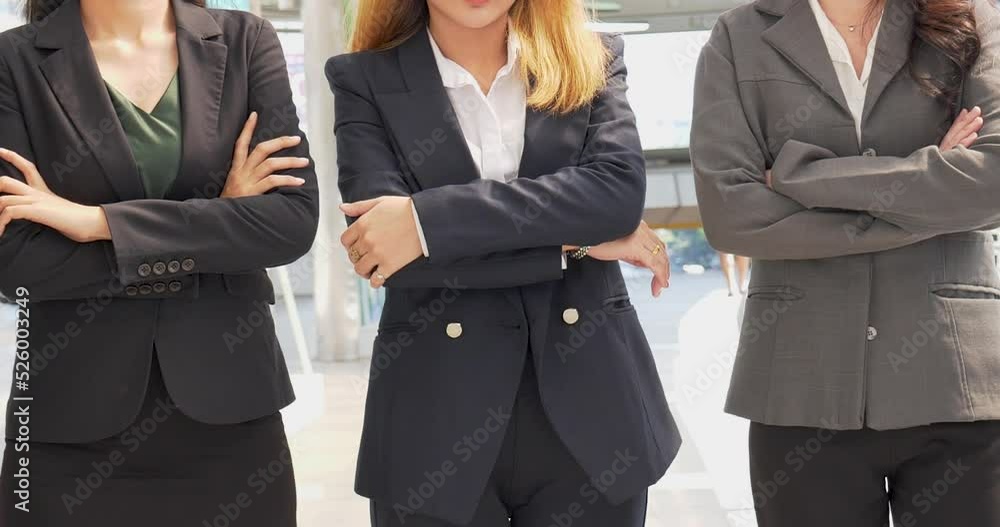 Close up group of businesspeople arms crossed focus hands teamwork ...