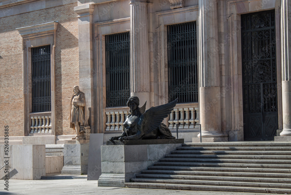 Columns, empty stairs, ancient bronze Siren Sphinx statue. Exterior ...
