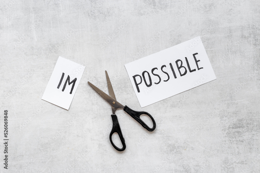 It is possible concept. Word Impossible becomes Possible with scissors ...
