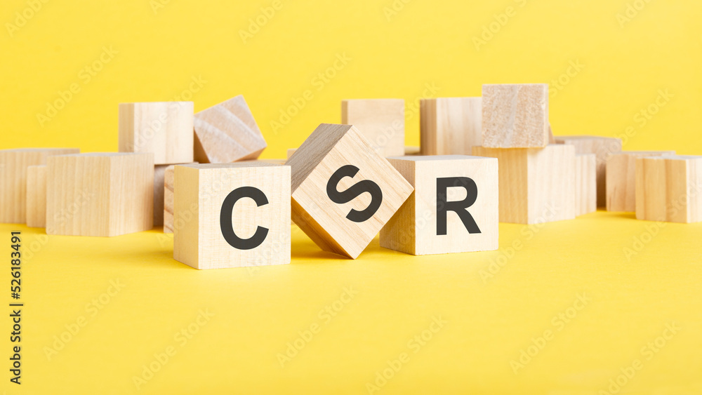 CSR, Corporate, Social, Responsibility symbol. wooden blocks with words ...