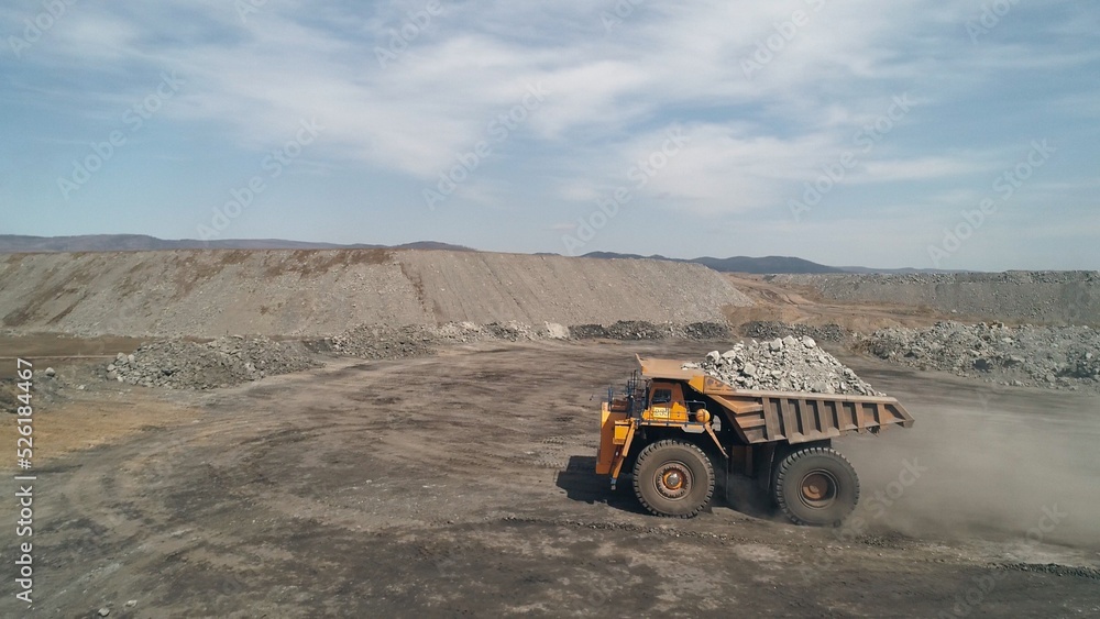 Place where waste rock tailings are dumped from coal pit. Big truck ...