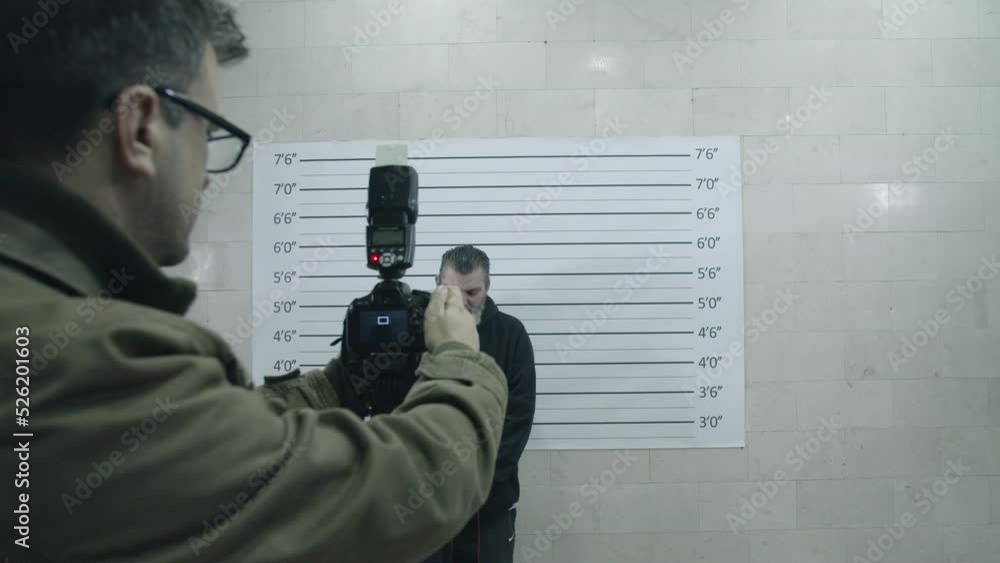 The detective investigator takes a photo for identification of the ...