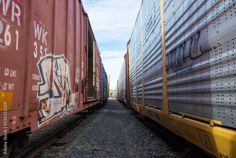 Perspective view of a space between two old trains on railways Stock ...