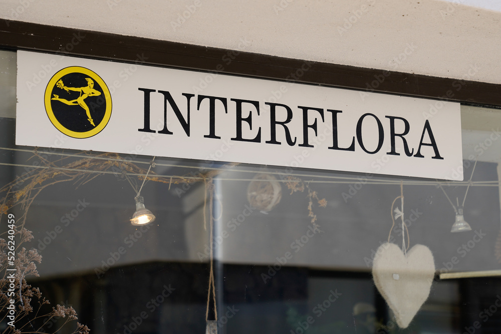 Interflora logo text and brand sign facade boutique of shop flowers and ...