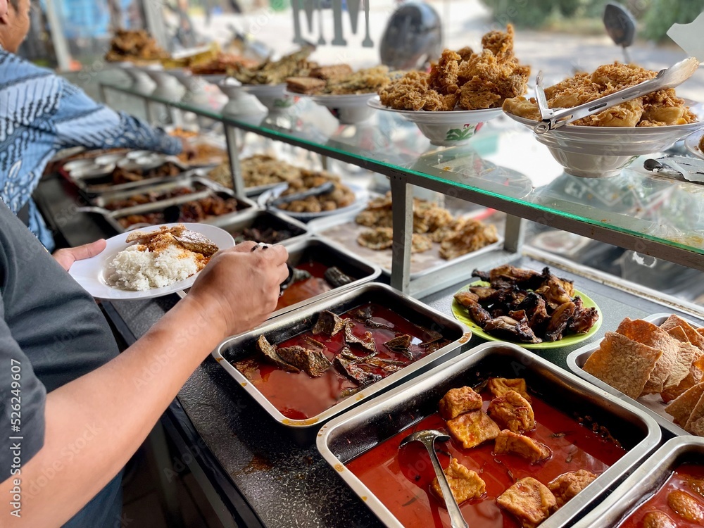 Padang food stalls share a variety of buffet menus with vegetables ...