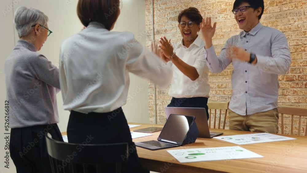 Group of asian Creative business people stack hands put palms together ...
