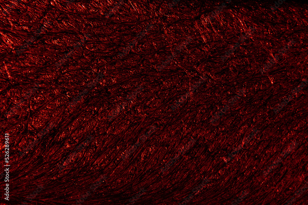 Crimson colored background with wavy textures of different shades of ...