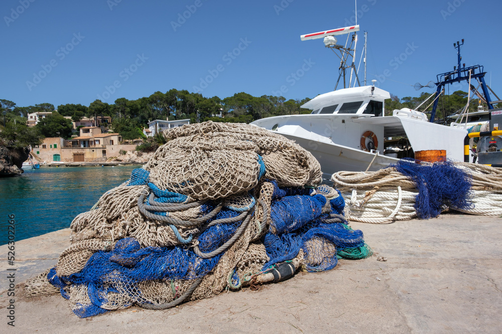 fishnet with ishing boat in the port of Cala Figuera in Mallorca, Spain ...