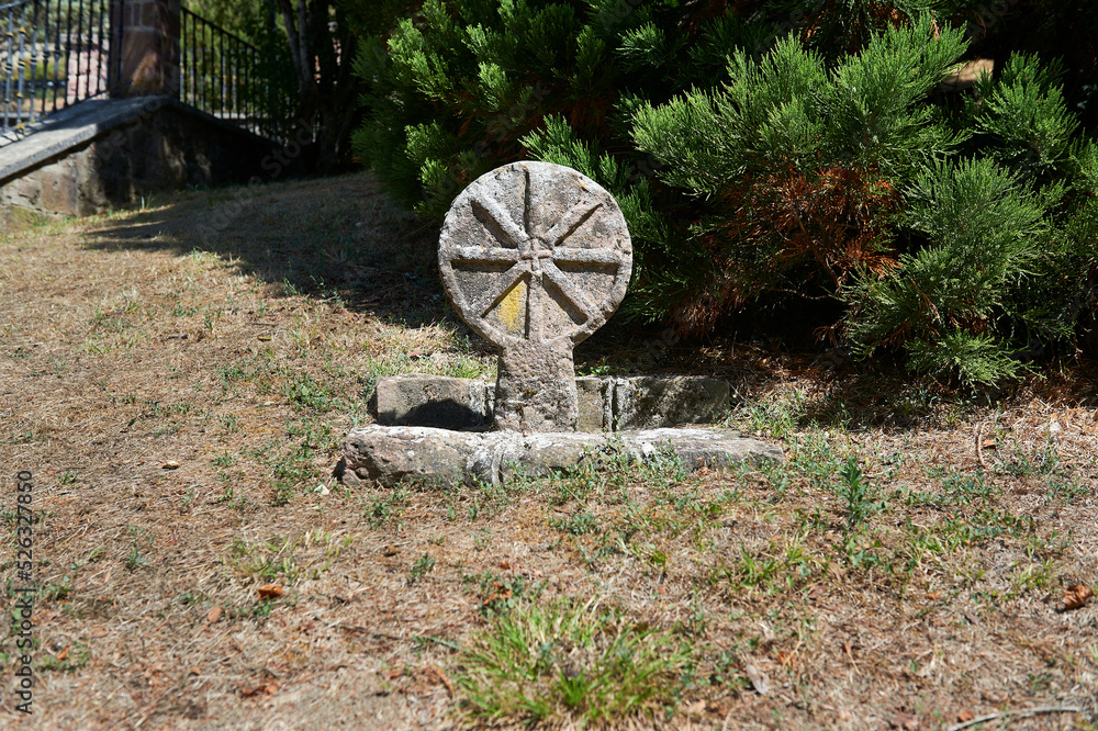 round funerary stele with an eight-pointed star and a cross in the ...