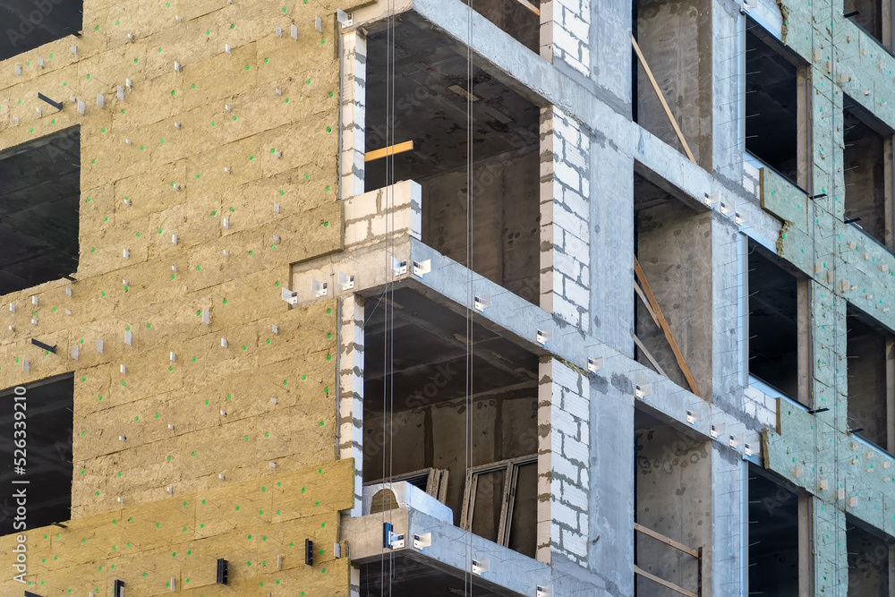 Installation of external wall thermal insulation with rock wool ...