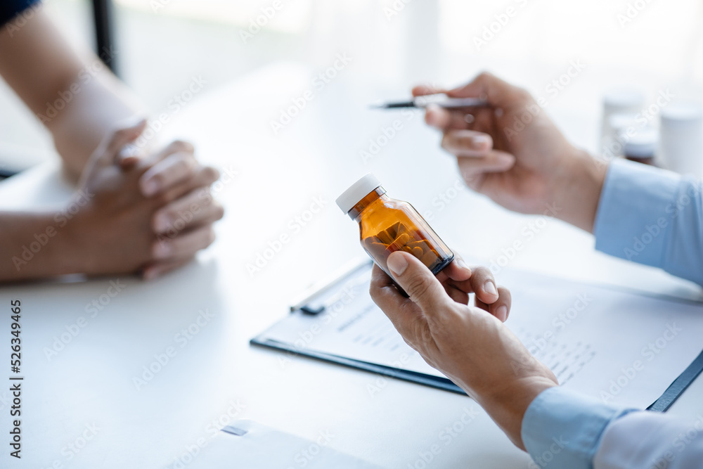 Doctor are recommending medicines to patients after being examined and ...