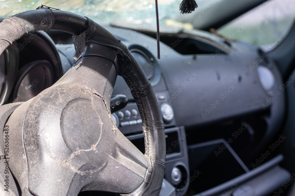 Close-up of the steering wheel of a car after an accident. The driver's ...