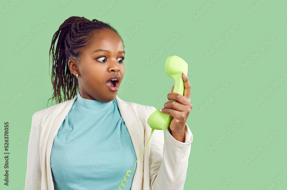 Young black woman gets shocking news over phone call and looks at ...