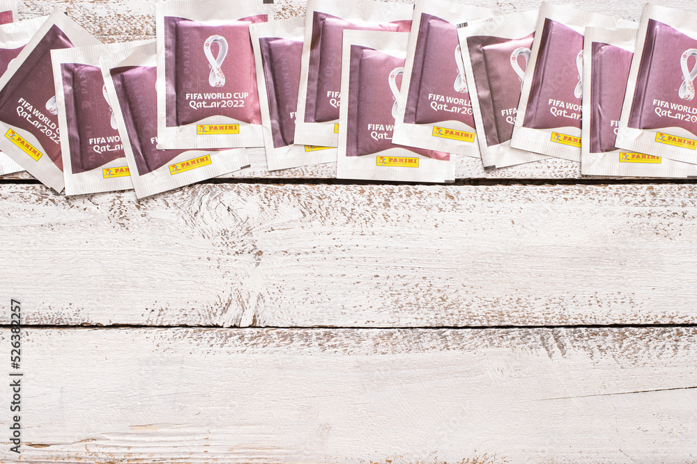 Panini sticker packs for Qatar 2022 lined up on a table in panoramic ...