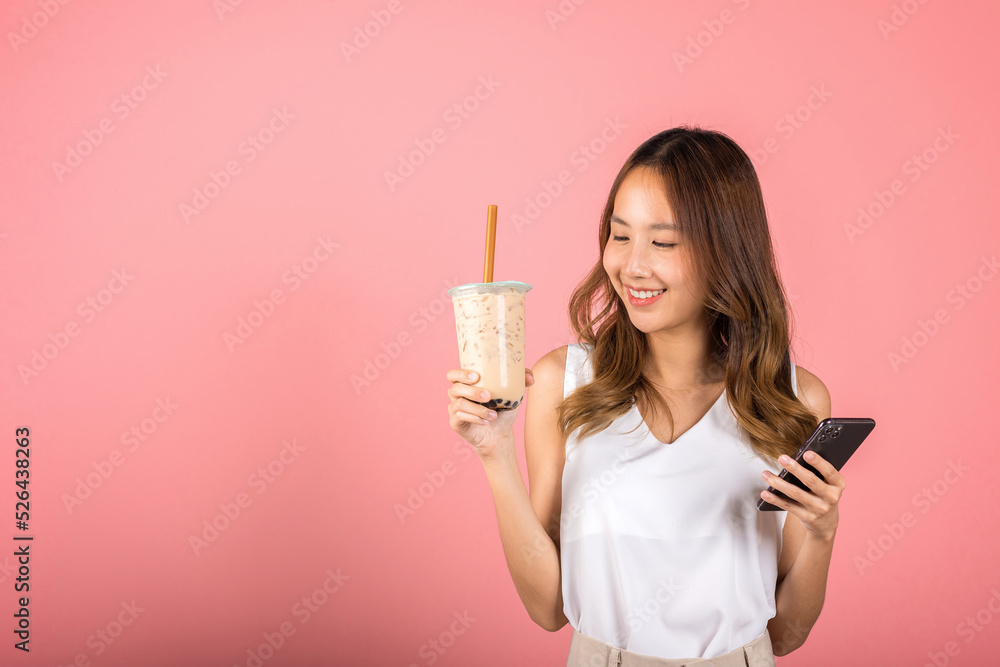 Asian beautiful young woman holding drinking brown sugar flavored ...