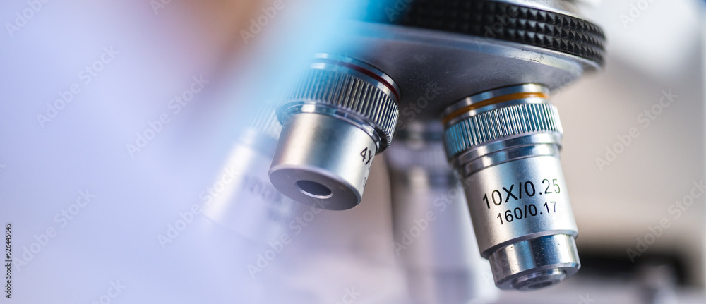 professional research scientist using microscope in science chemistry ...