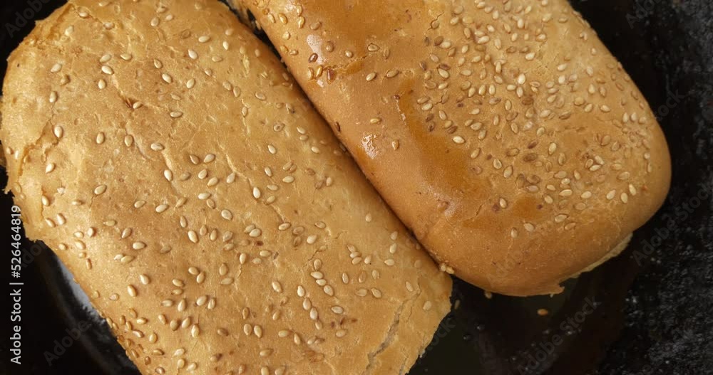 sesame sandwich buns in a pan top view. High quality 4k footage Stock ...