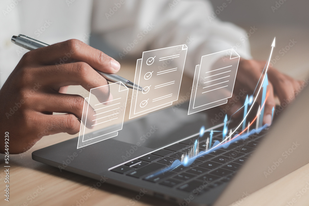 Poster Businessman using laptop analyzing sales data graph growth on ...